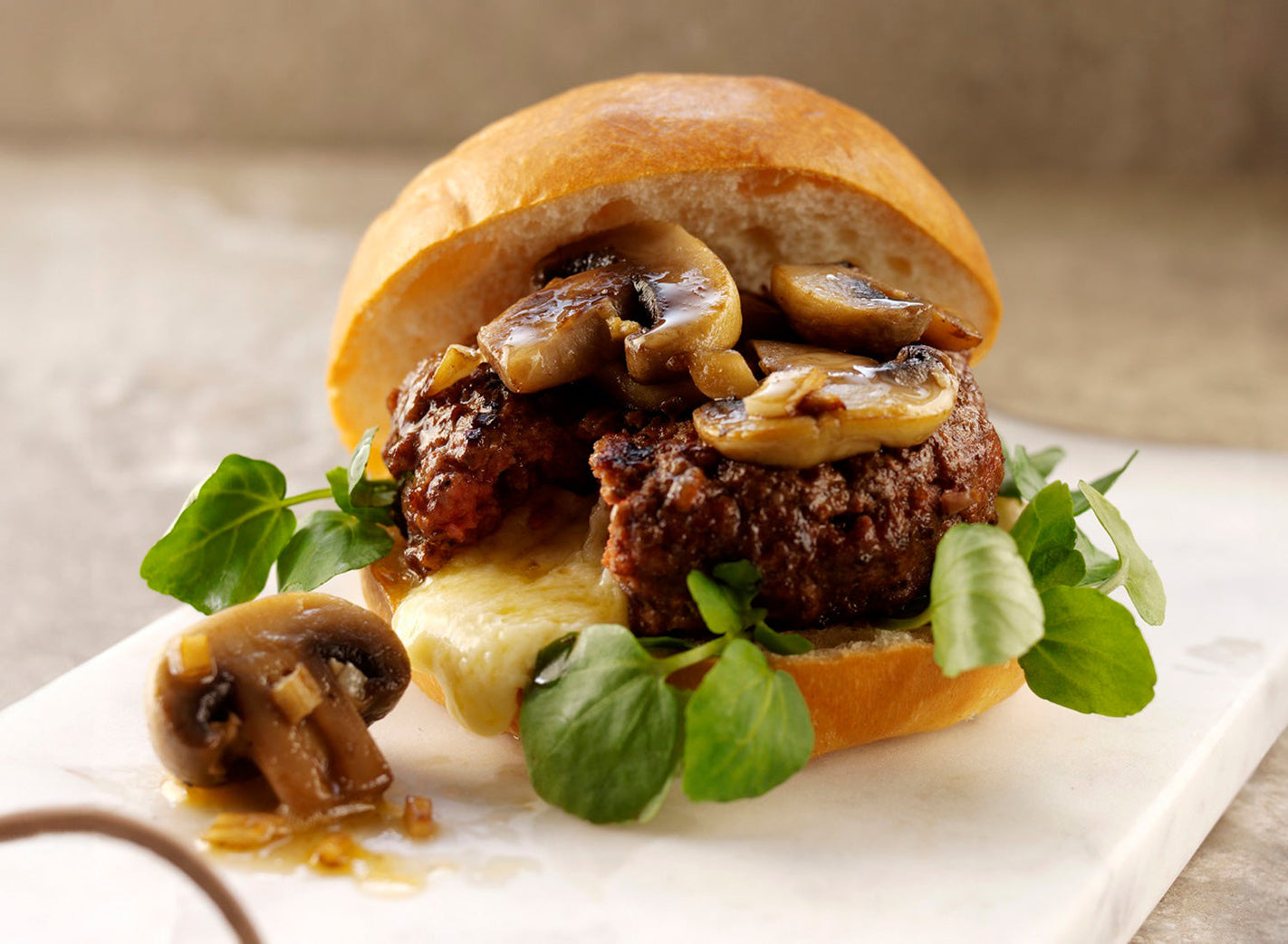 Black Bomber Surprise Burger topped with Garlic Mushrooms